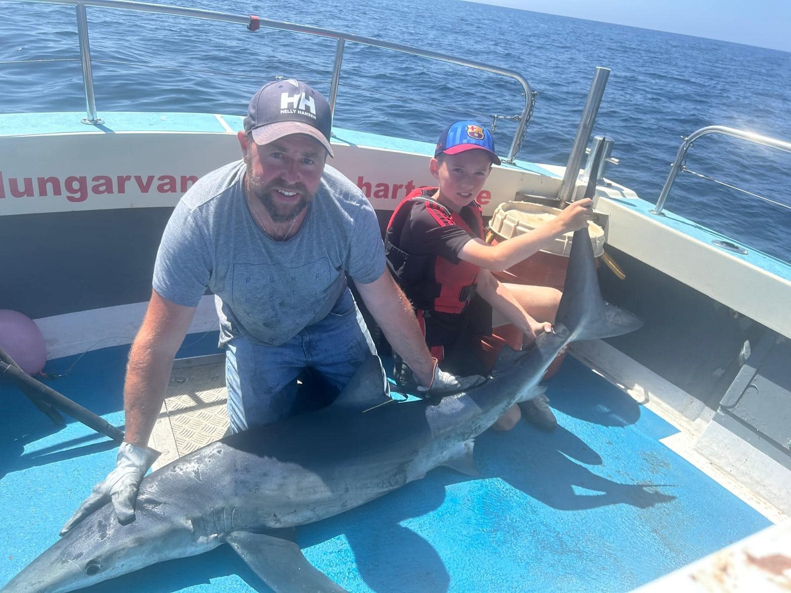 Exhausted anglers stop at shark number 23 as 10 circle the boat ...